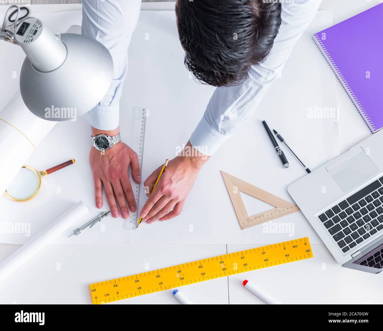 The engineer working on new project drawings Stock Photo - Alamy