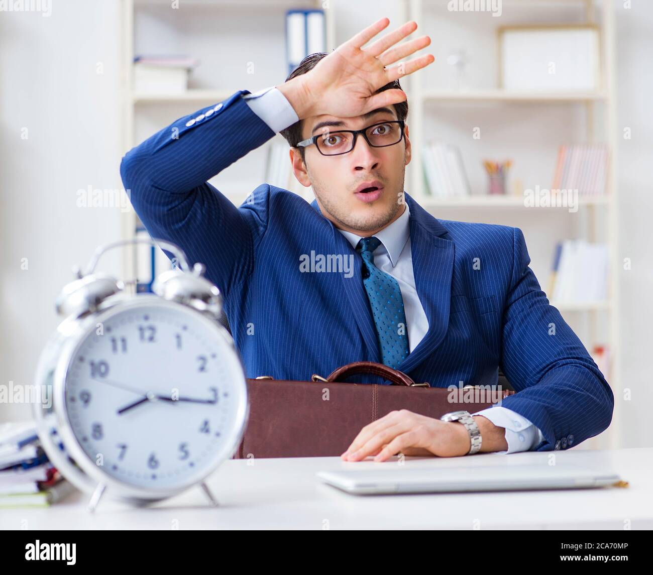 The businessman in bad time management concept Stock Photo - Alamy