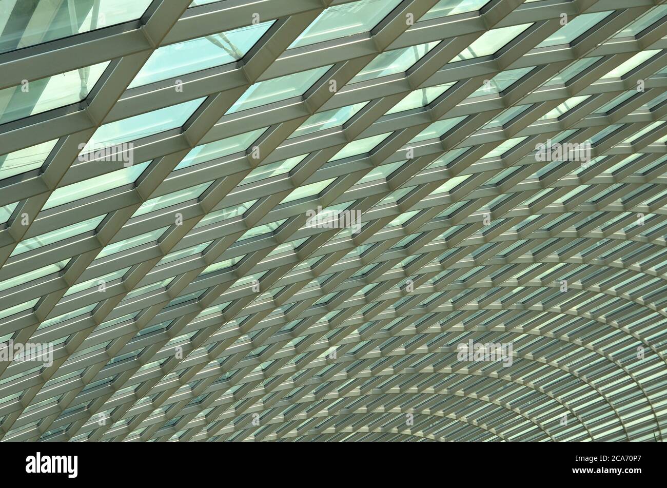 Modern building with curving roof and glass steel column Stock Photo ...