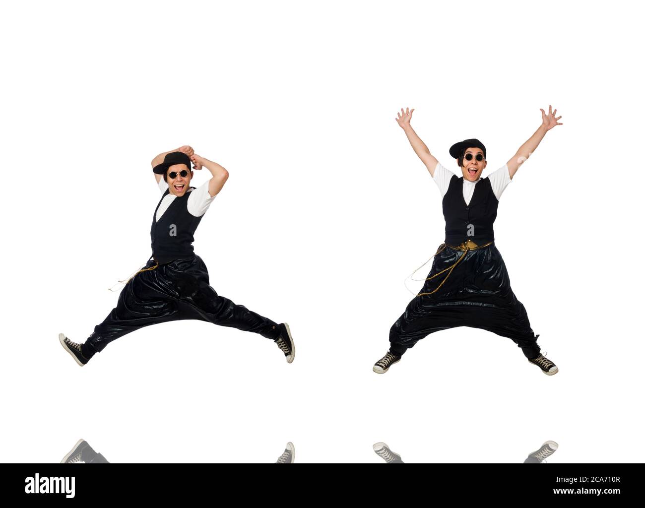 The funny young man dancing isolated on white Stock Photo - Alamy