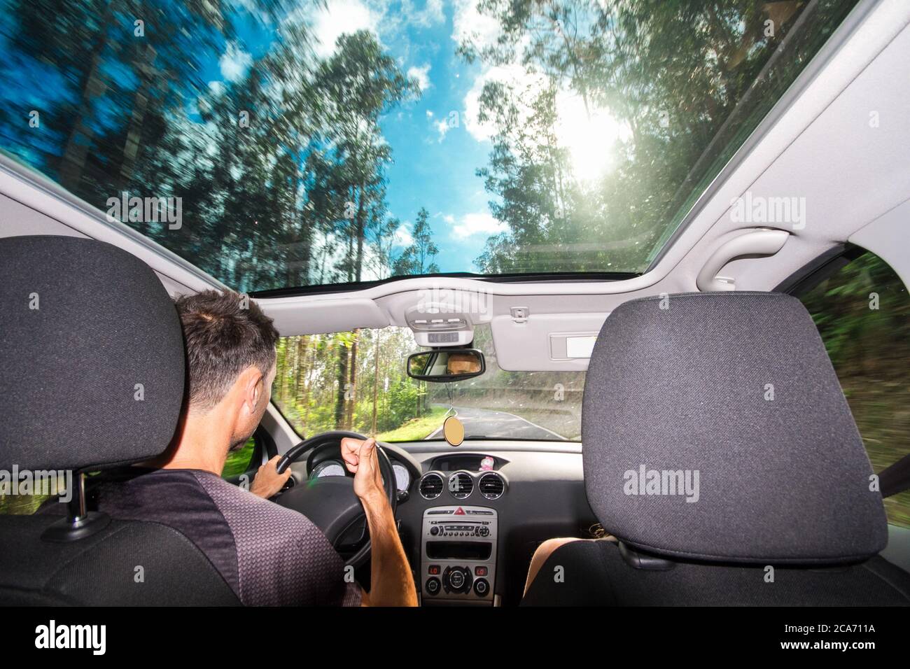 Enjoying driving a nice semi-convertible car trip Stock Photo - Alamy