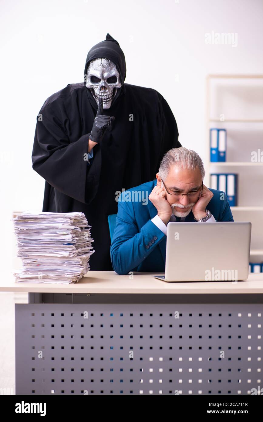 Old businessman employee making deal with the devil Stock Photo - Alamy
