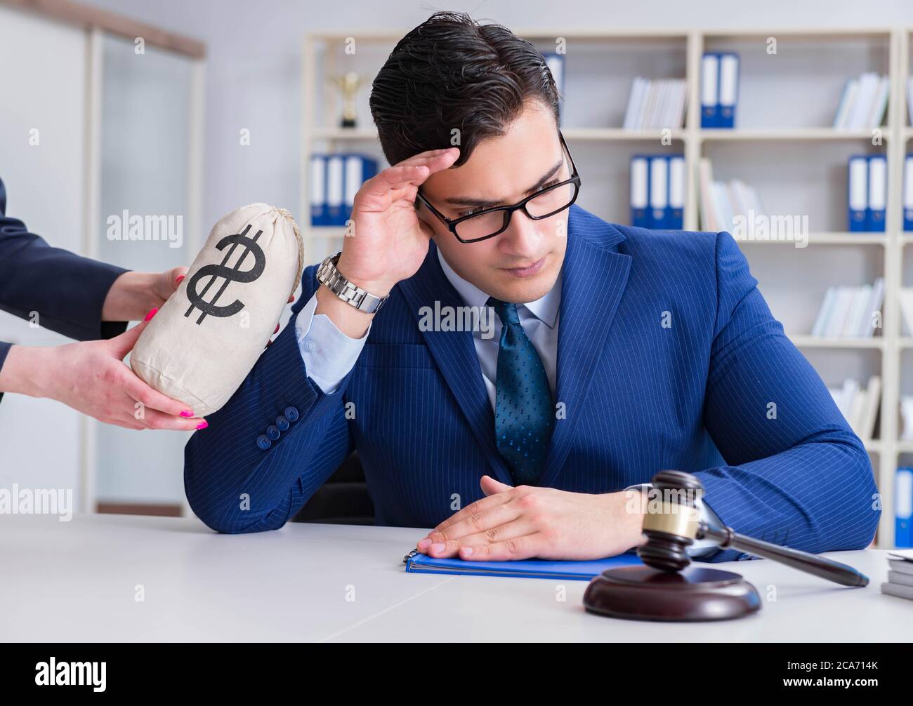 The judge in bribe concept with money Stock Photo - Alamy