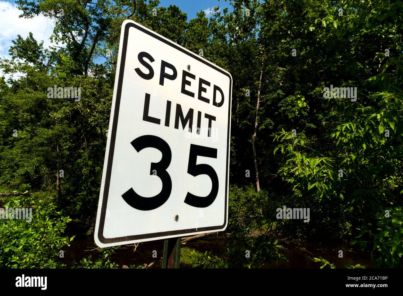Speed limit thirty-five traffic safety sign on side of the road Stock ...