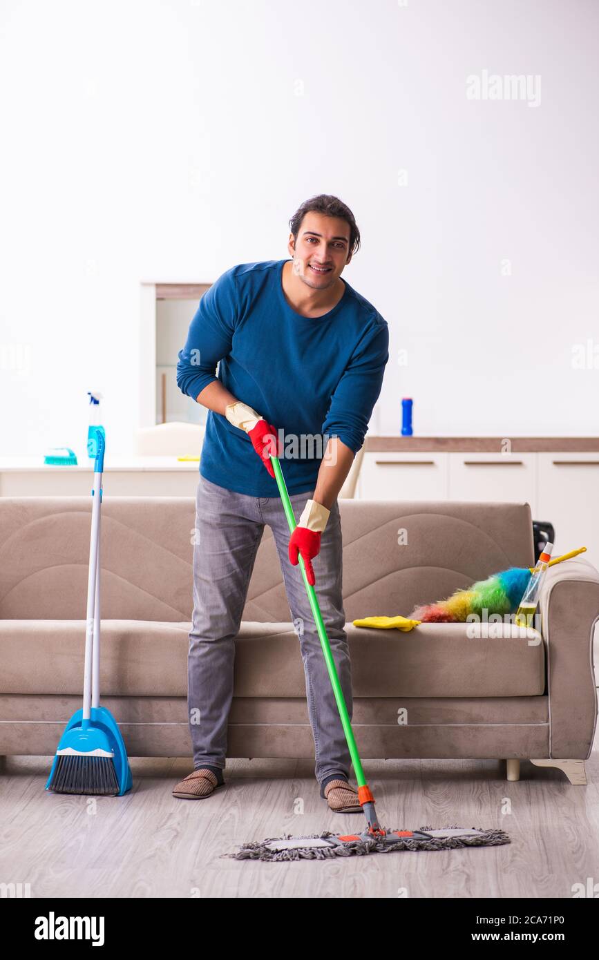 Young man husband doing housework Stock Photo - Alamy