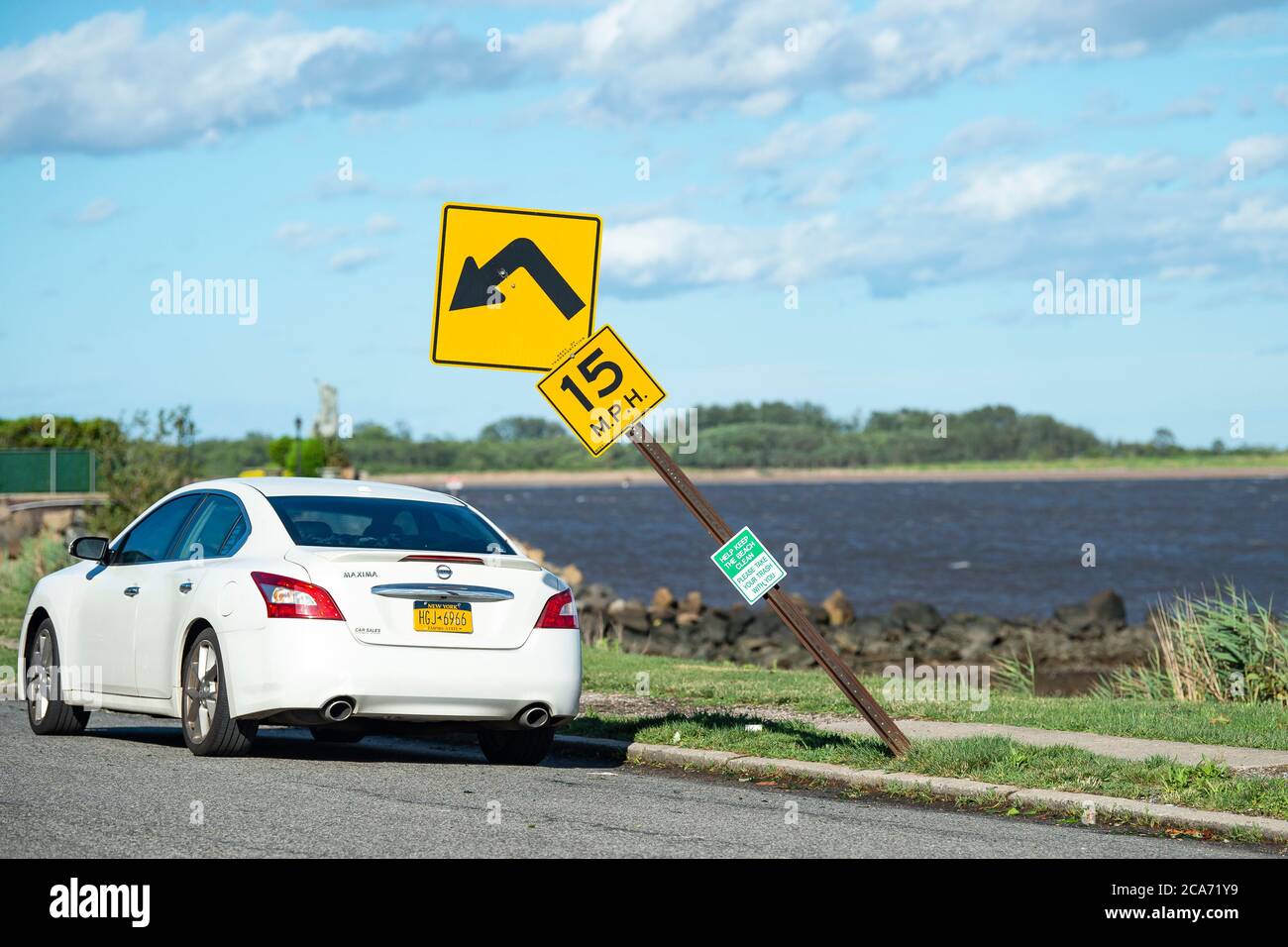 August 04, 2020: A street sign remains bent due to wind damage from ...
