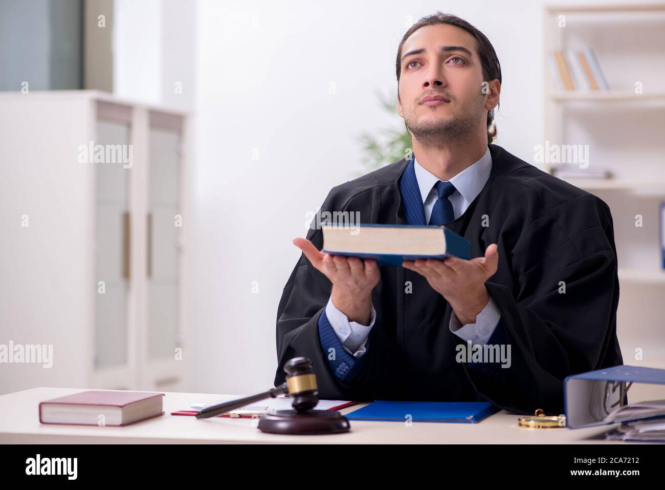 Young judge working in courthouse Stock Photo - Alamy