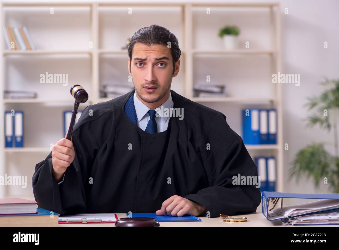 Young judge working in courthouse Stock Photo - Alamy
