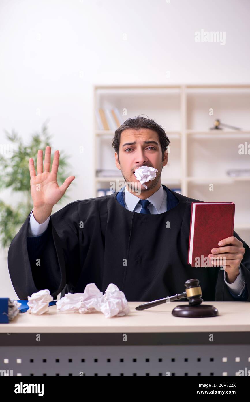 Young judge working in courthouse Stock Photo - Alamy