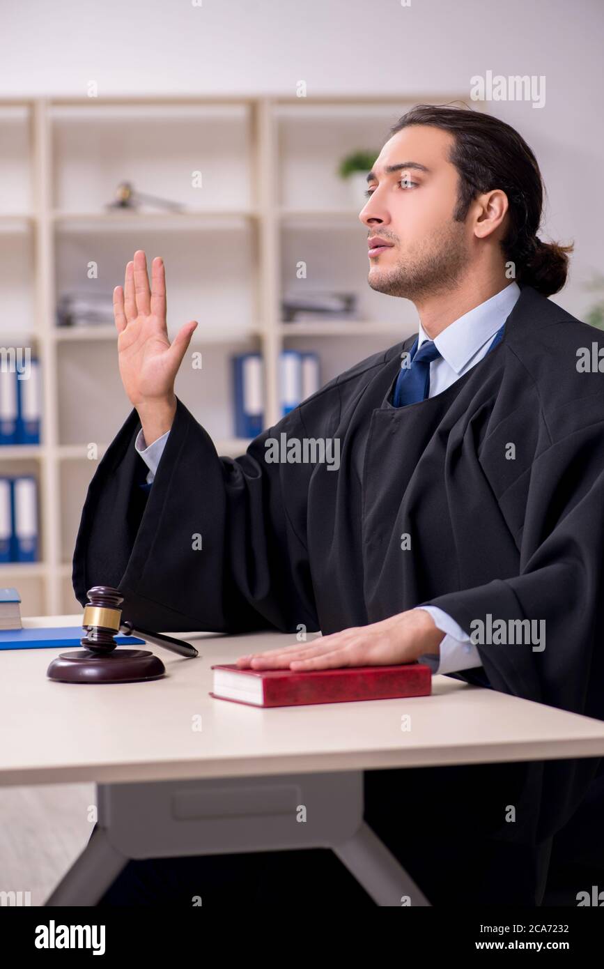Young judge working in courthouse Stock Photo - Alamy