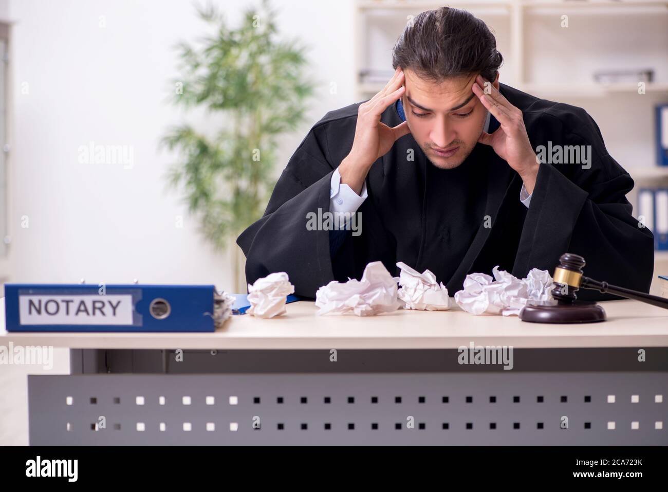 Young judge working in courthouse Stock Photo - Alamy