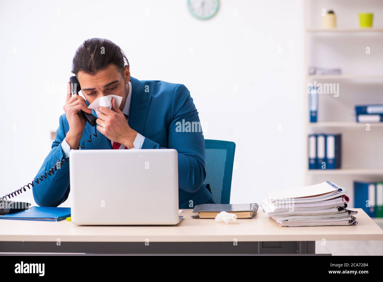 Sick employee suffering at workplace from covid-19 Stock Photo - Alamy