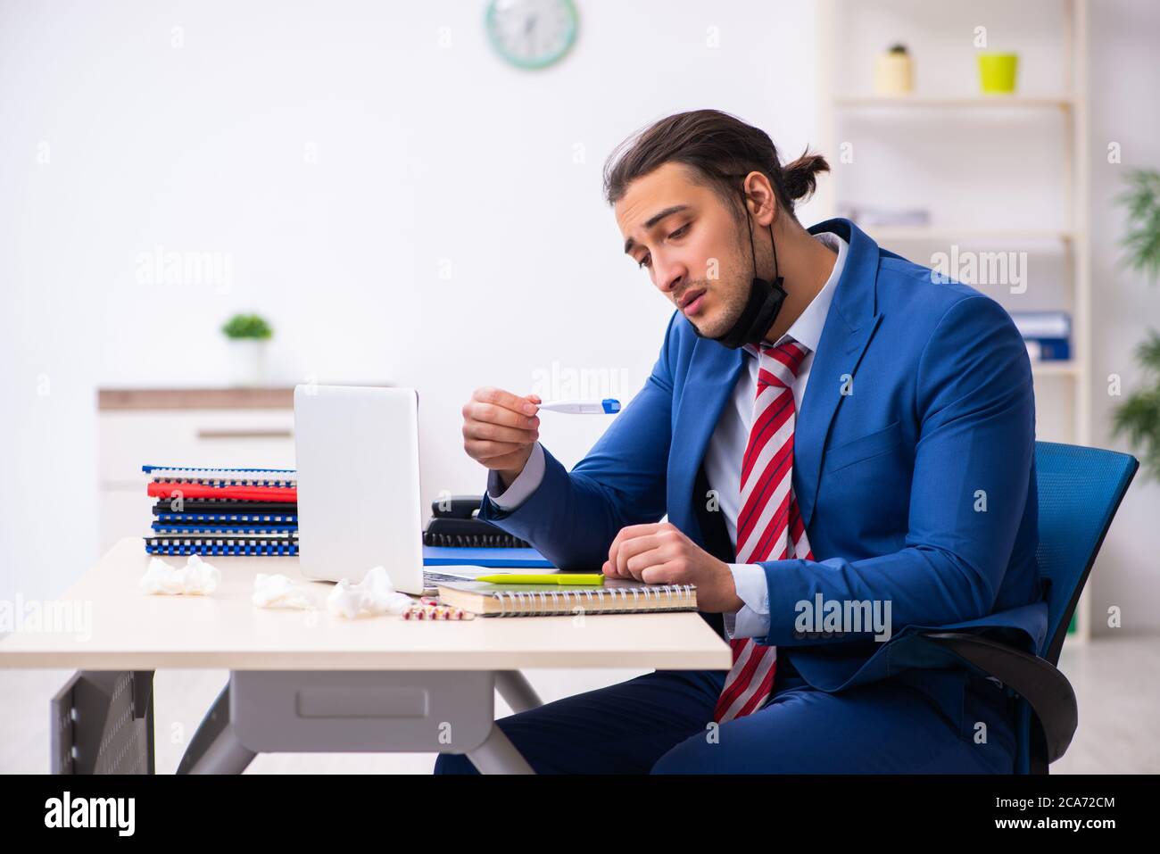 Sick employee suffering at workplace from covid-19 Stock Photo - Alamy