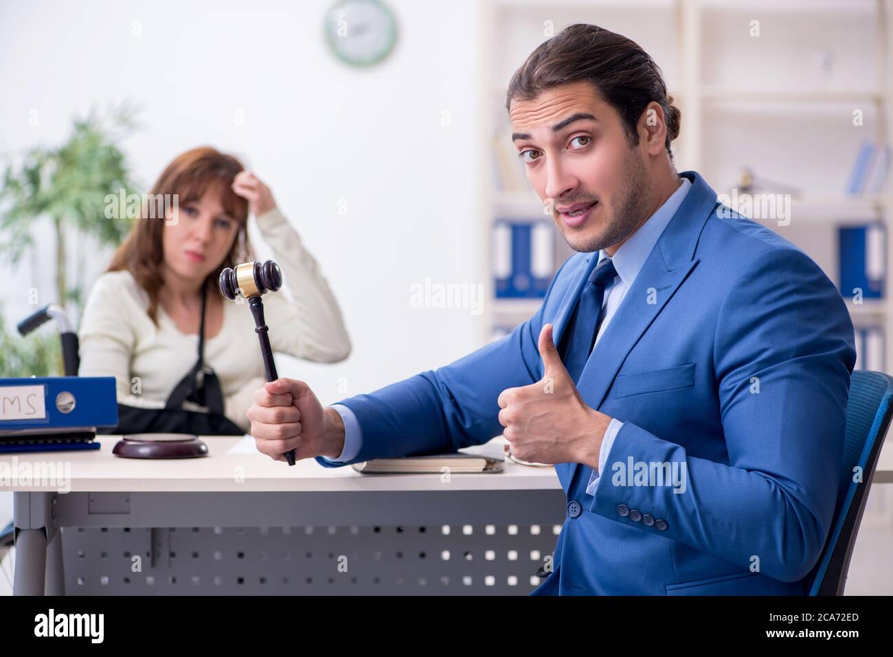 Injured woman and judge in the courtroom Stock Photo - Alamy
