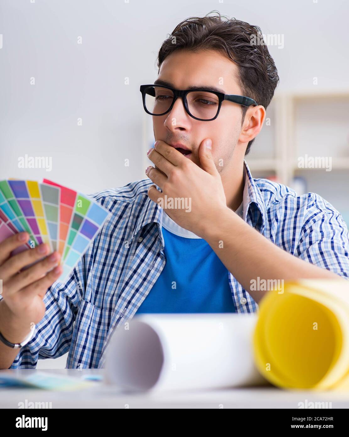 The young designer working on new project and choosing colours Stock ...