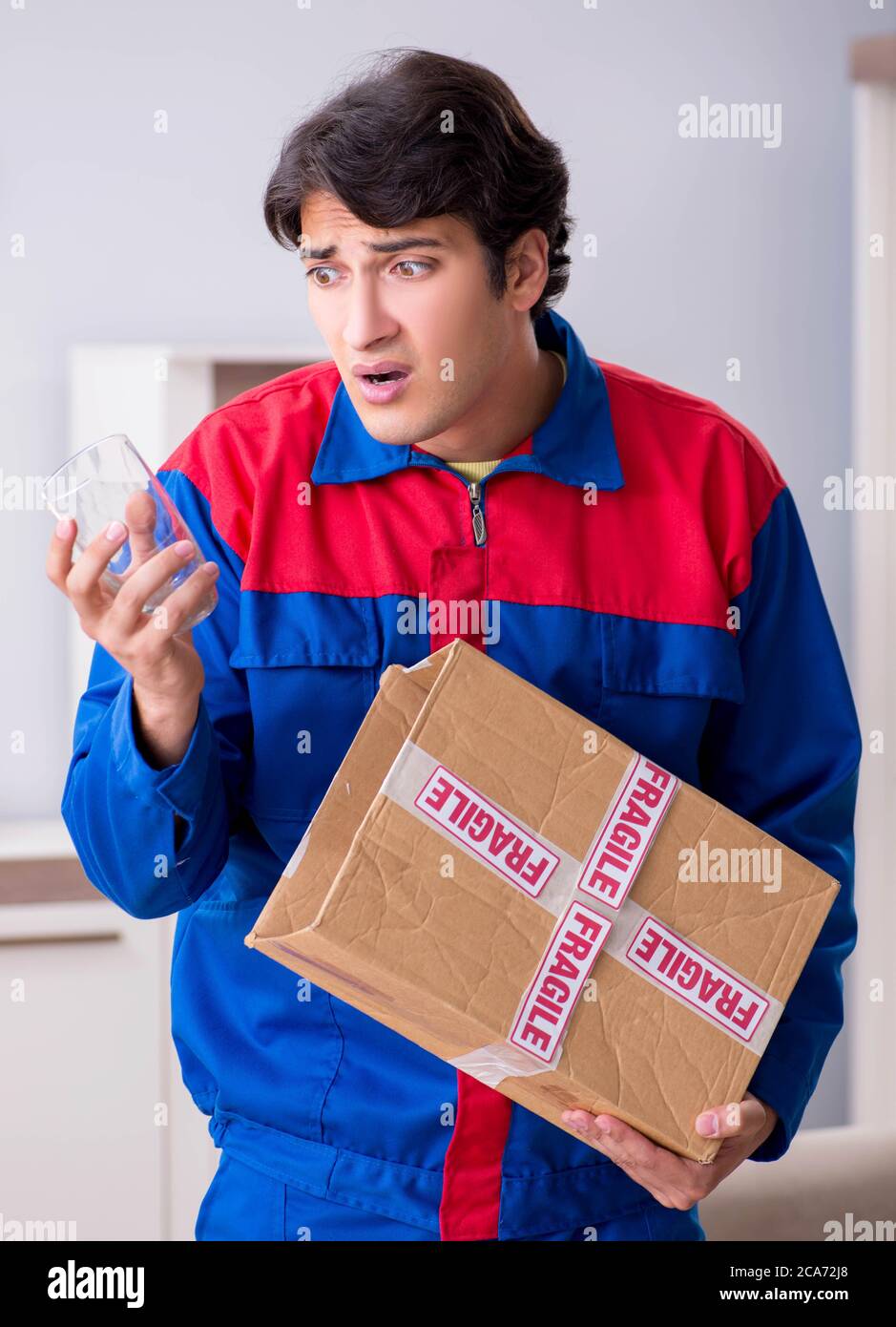 The transportation contractor with fragile boxes Stock Photo - Alamy