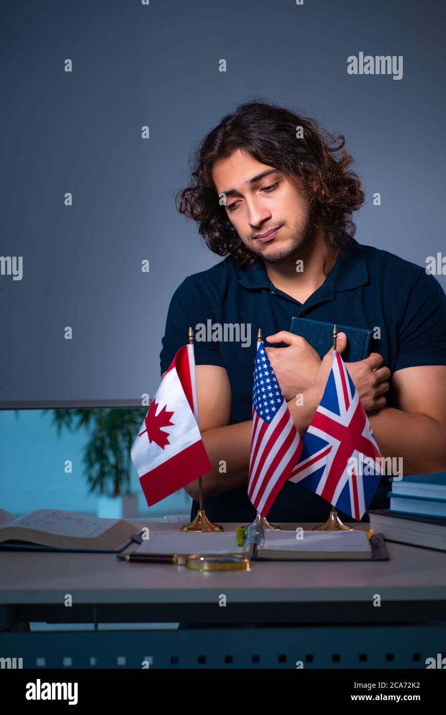 Young student in the classroom at night Stock Photo - Alamy
