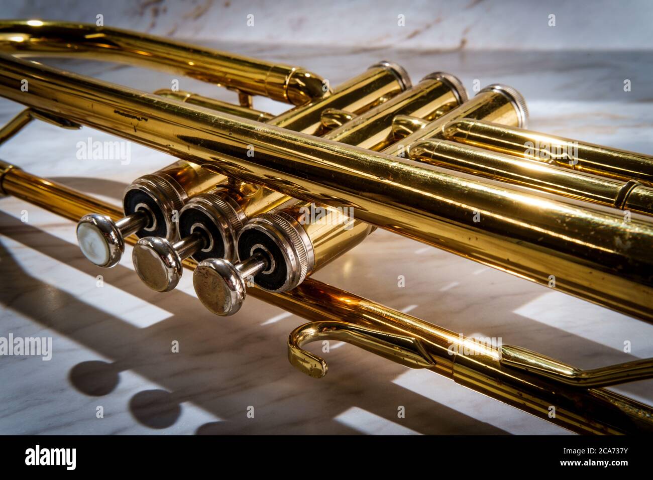 Rusty old dented classical trumpet on marble table Stock Photo - Alamy