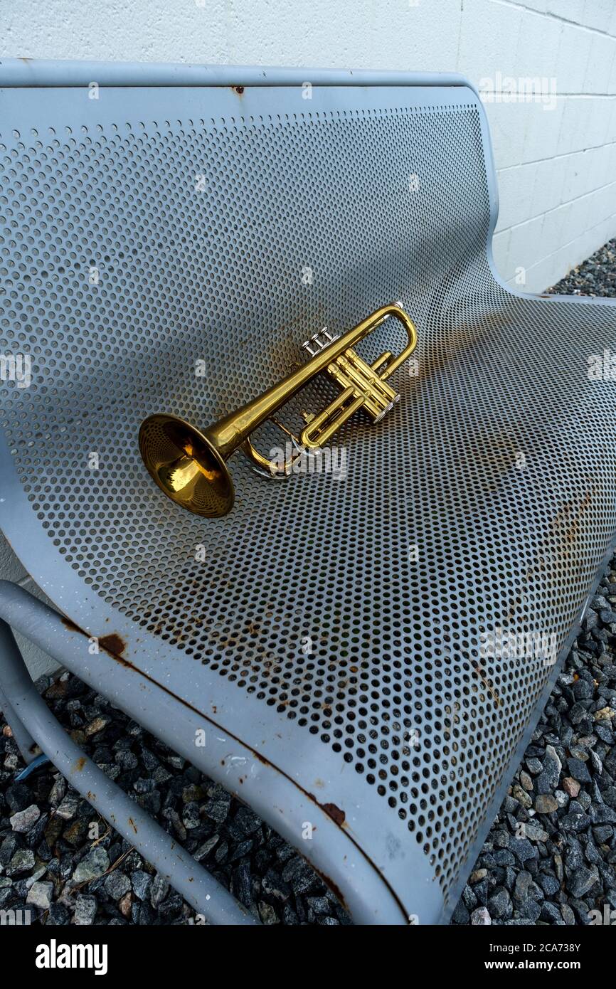 Old rusty Jazz instrument trumpet abandoned on park bench Stock Photo ...