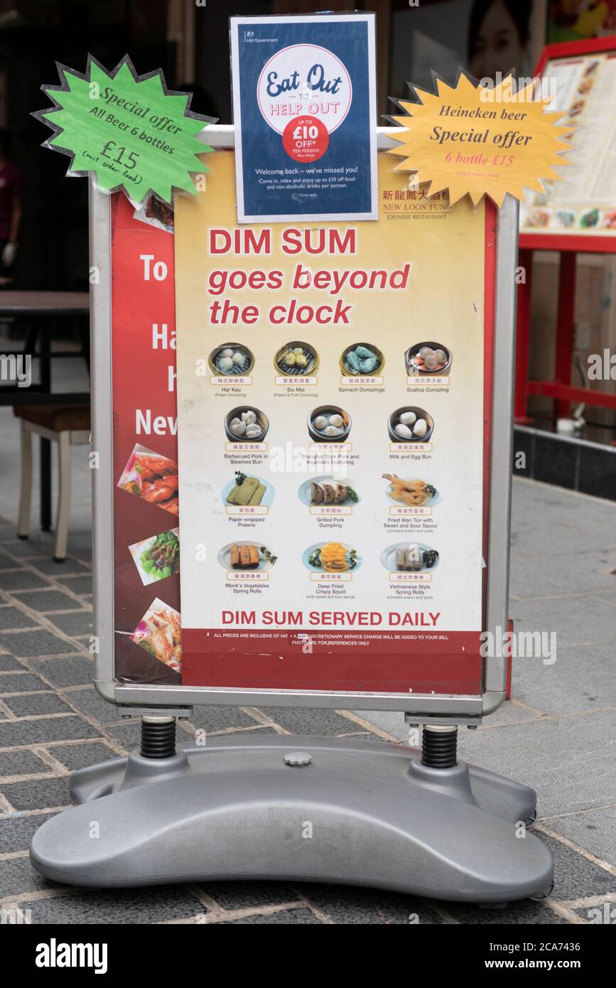 Restaurant street signs promote a discount on food promoting the UK ...