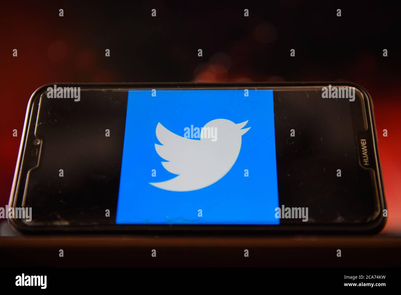 In this photo illustration, a Twitter logo is displayed on a smartphone ...