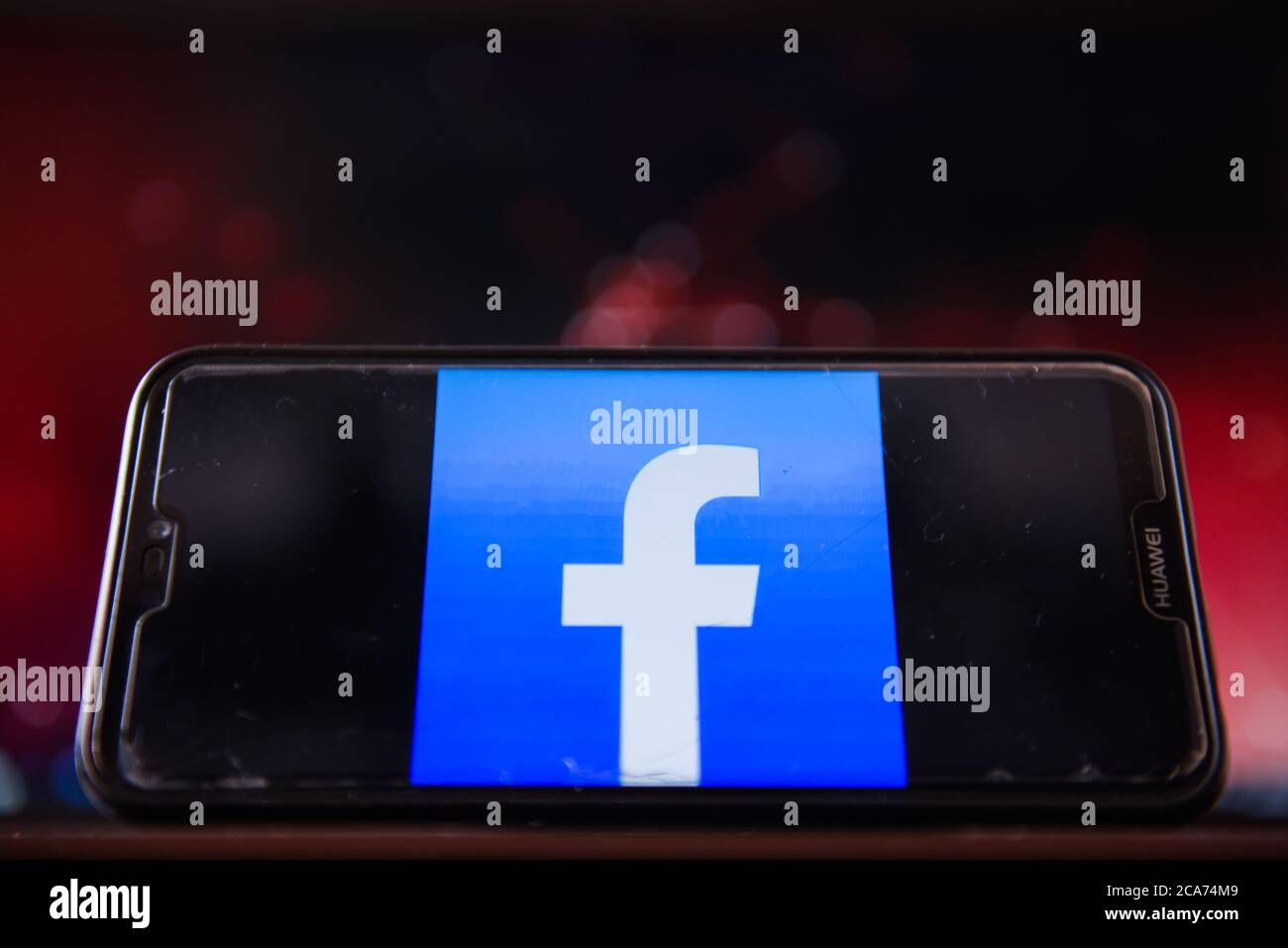 In this photo illustration, a Facebook logo is displayed on a ...