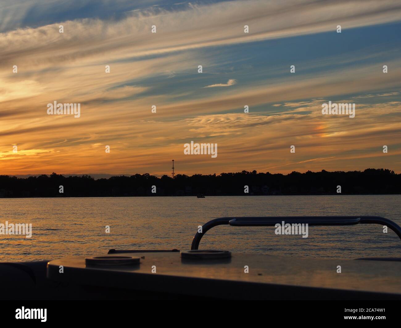 Lake Sunset Reflecting on Pontoon Boat Stock Photo - Alamy
