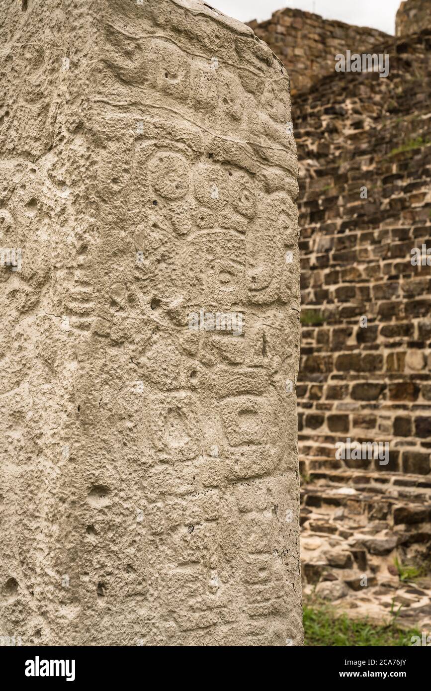 Stela 9 is a stone obelisk carved on all four sides in front of the ...