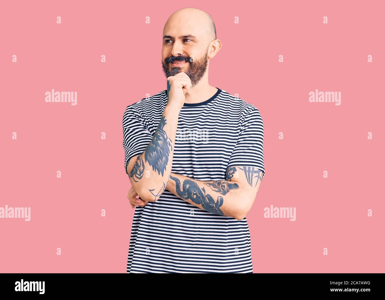 Young handsome man wearing casual clothes with hand on chin thinking ...