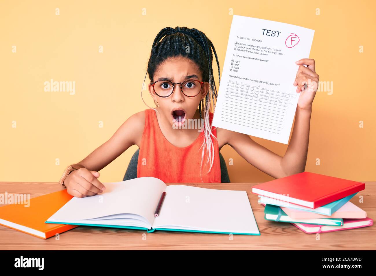 Young african american girl child with braids showing failed exam ...