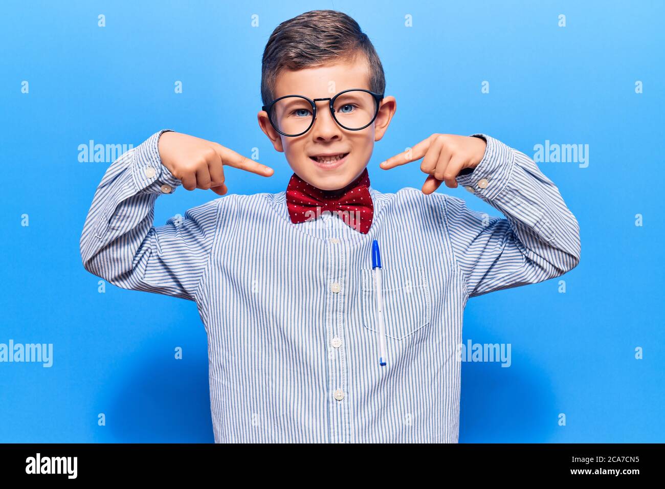 Cute blond kid wearing nerd bow tie and glasses smiling cheerful ...