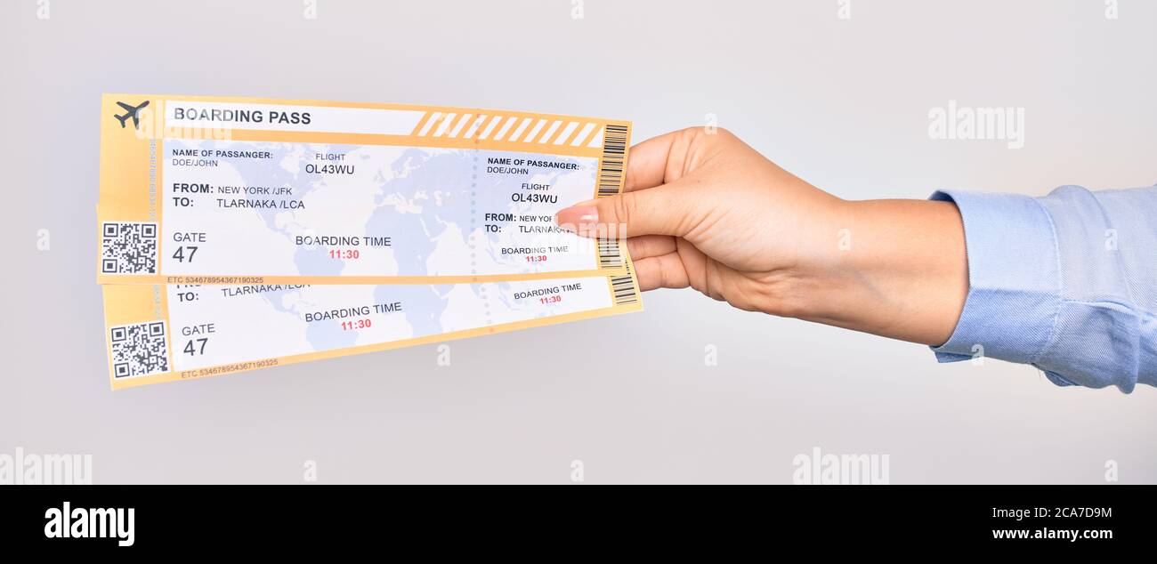 Hand of caucasian young woman holding boarding pass airlane over ...