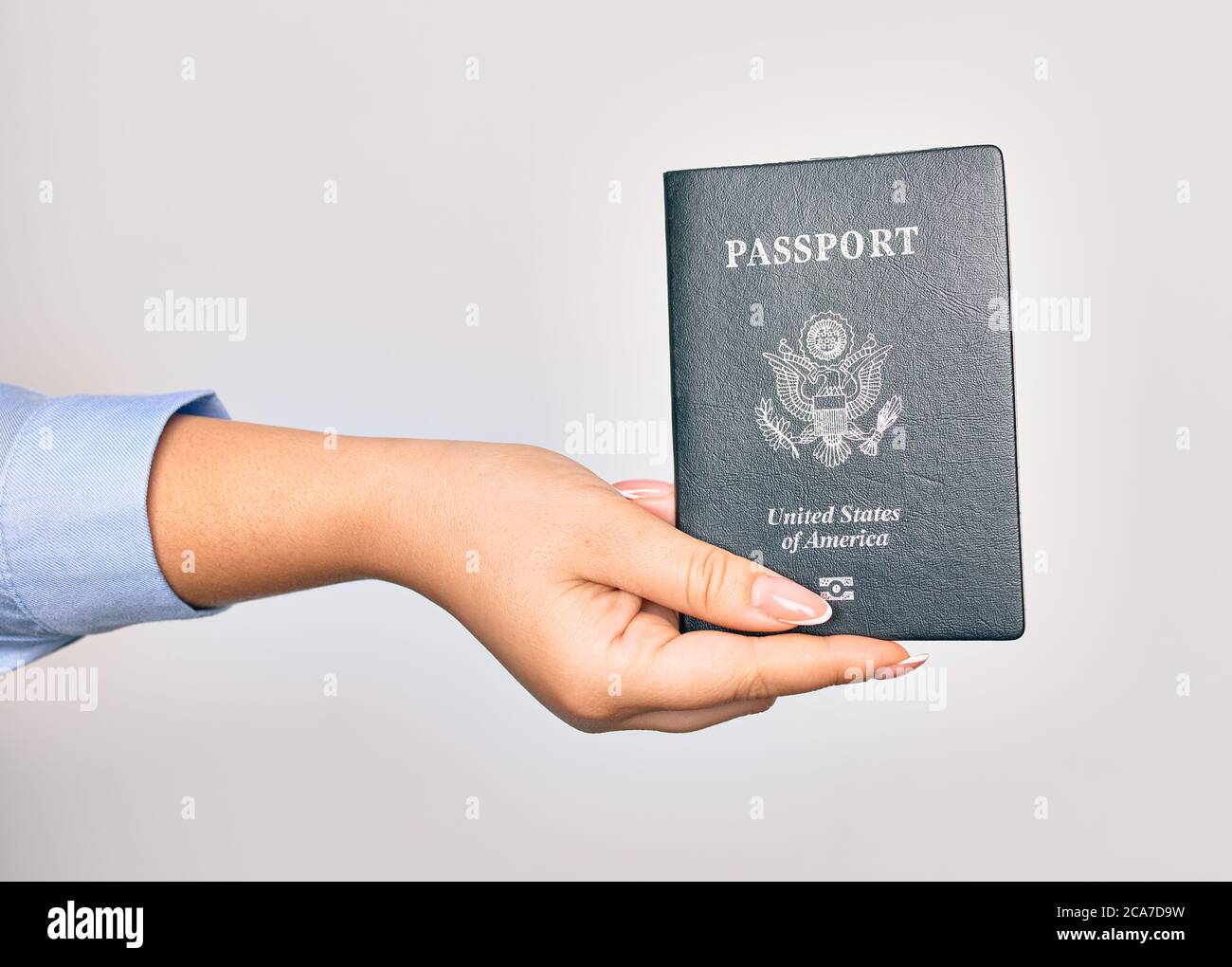 Hand of caucasian young woman holding united states passport document ...
