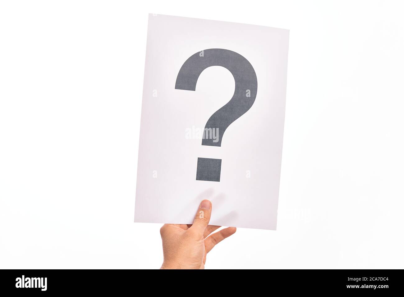 Hand of caucasian young man holding paper showing question mark over ...