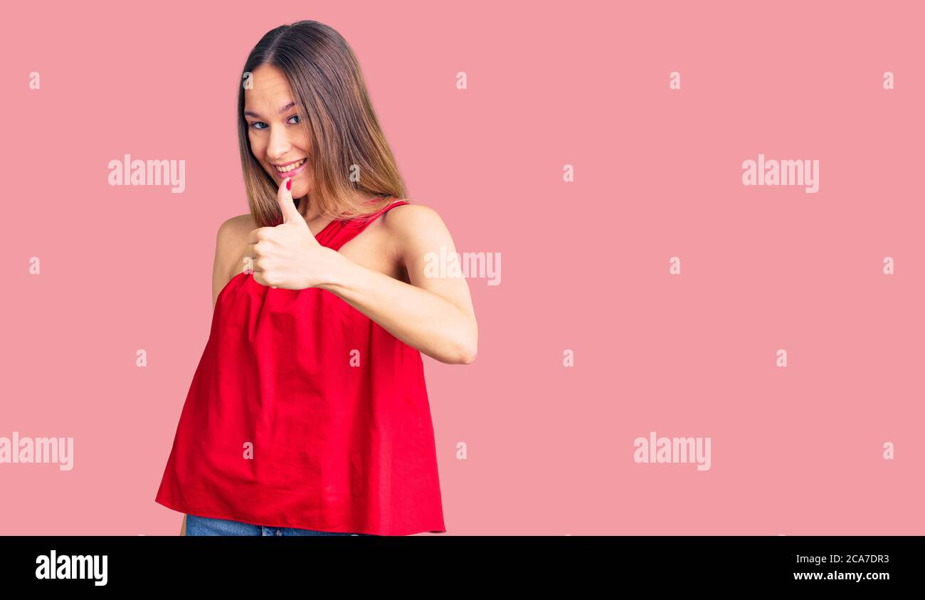 Beautiful brunette young woman wearing casual clothes doing happy ...