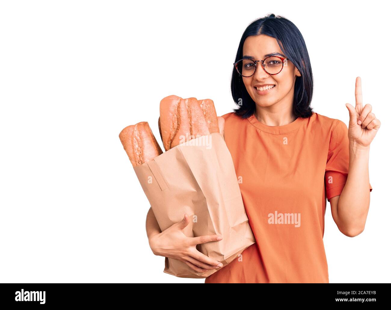Woman holding bread happy Cut Out Stock Images & Pictures - Alamy