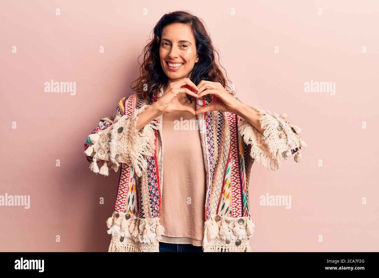 Young beautiful hispanic woman wearing casual clothes smiling in love ...