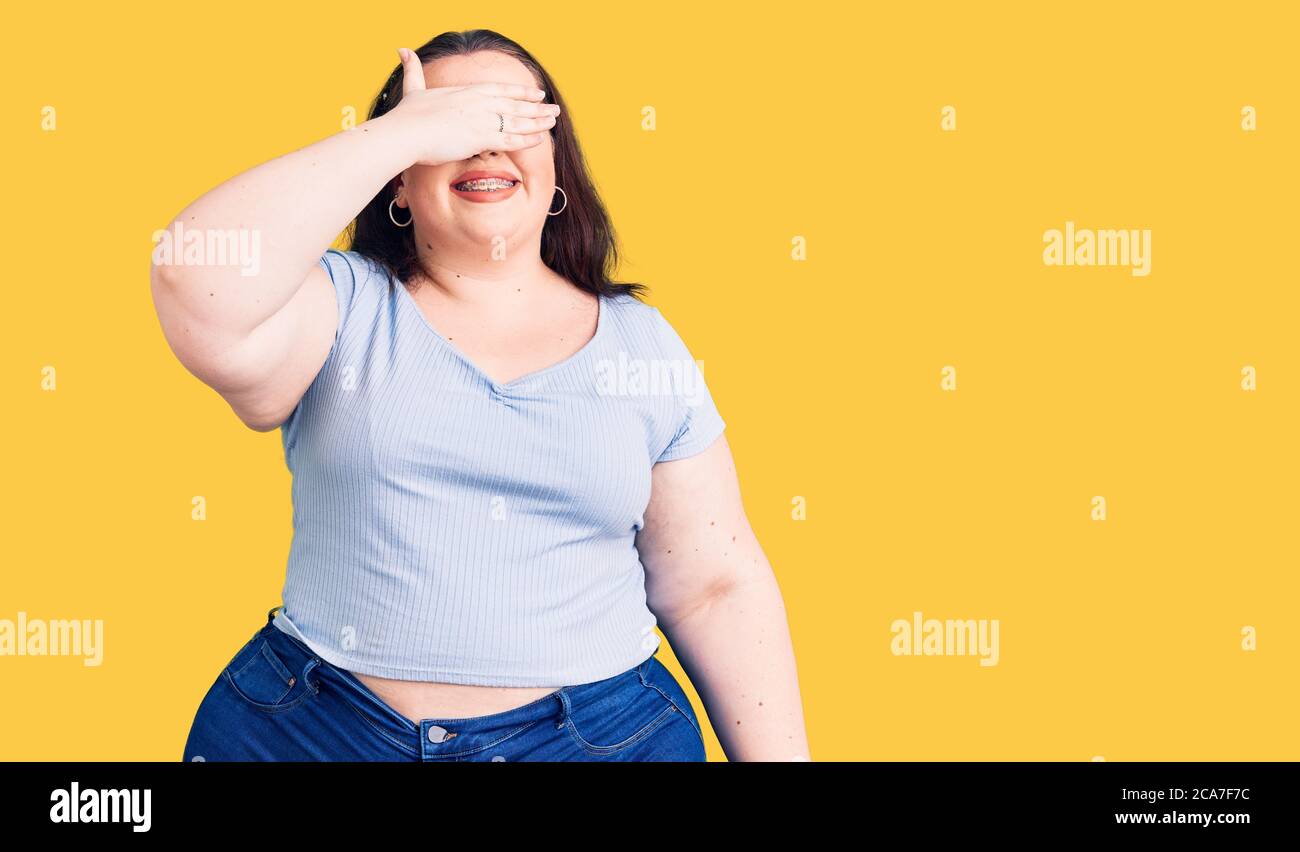 Young plus size woman wearing casual clothes smiling and laughing with ...
