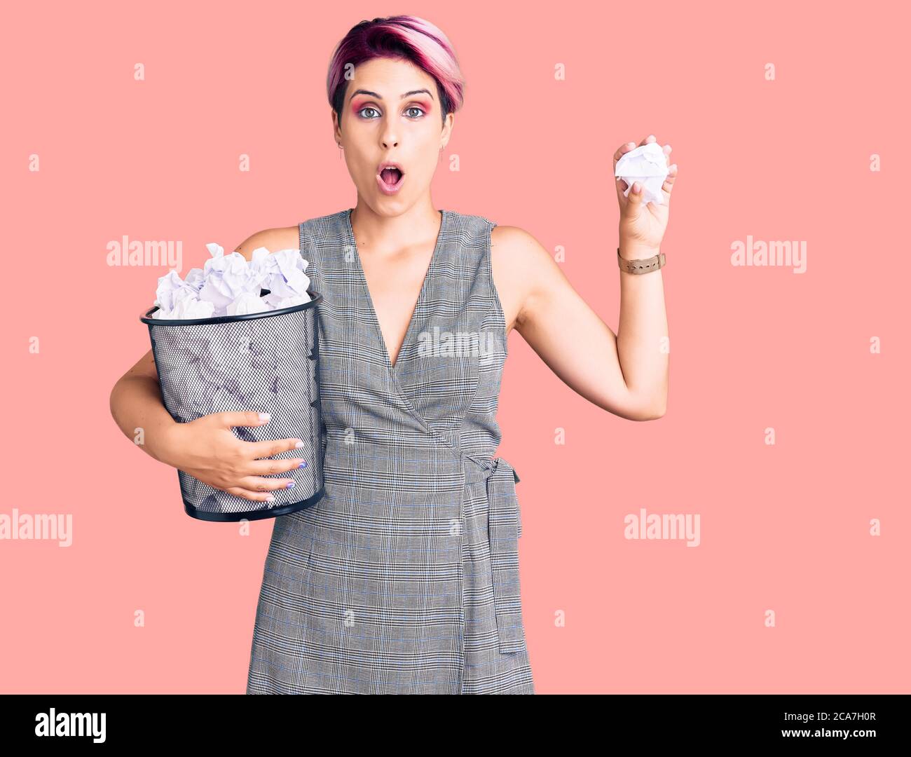 Woman holding papers shocked hi-res stock photography and images - Alamy
