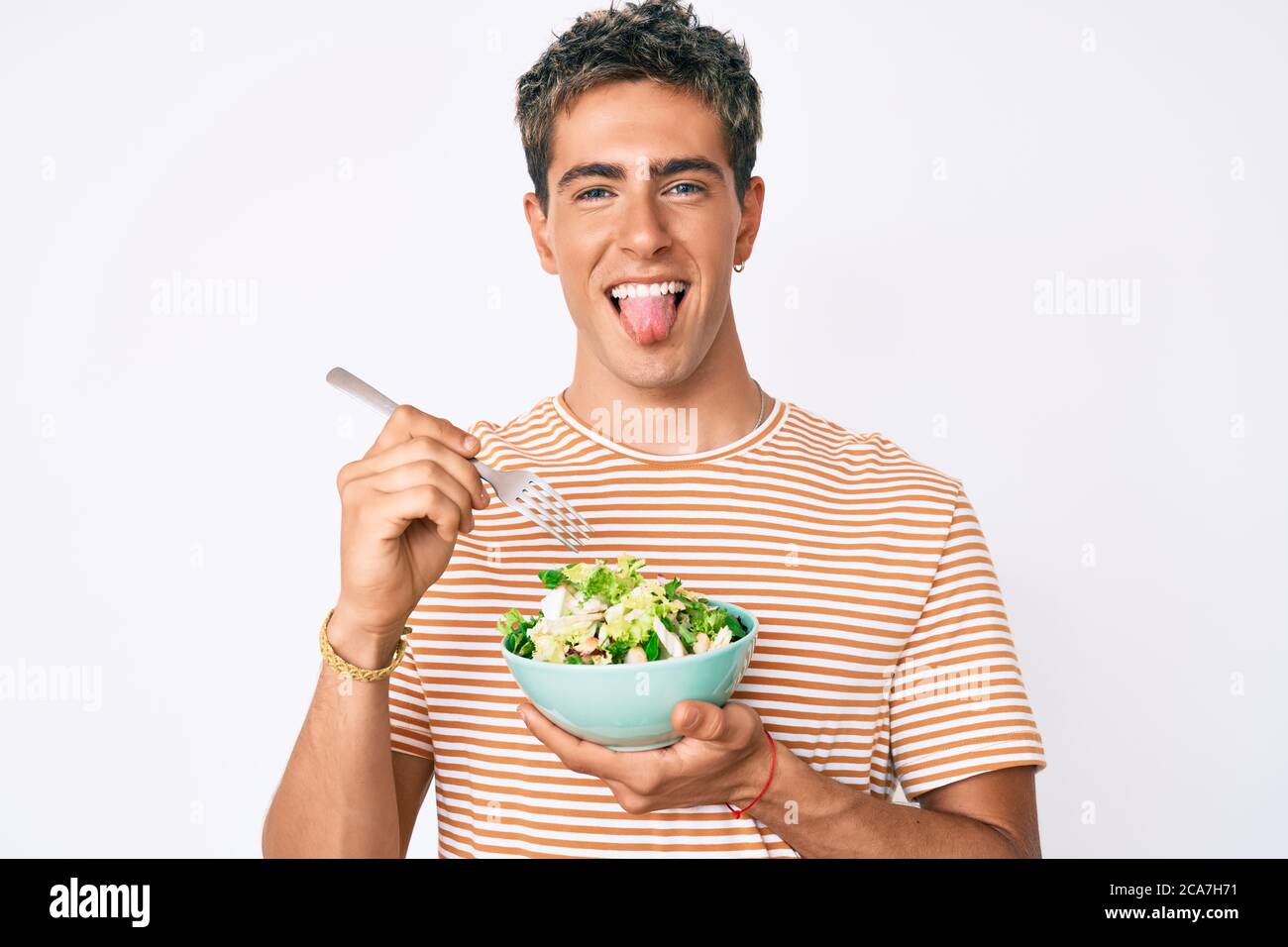 Funny happy man eating salad hi-res stock photography and images - Alamy