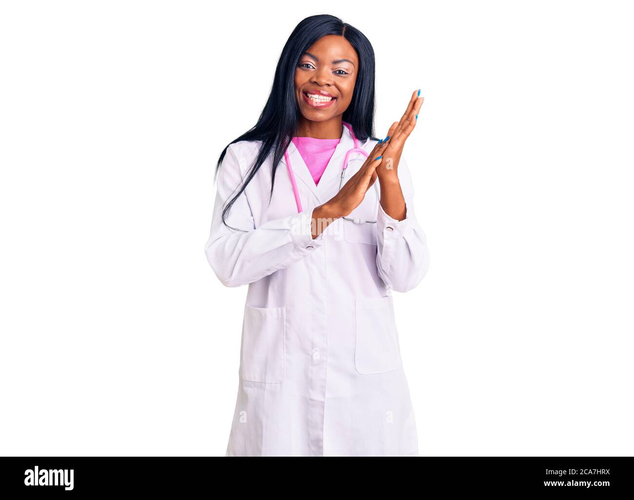 Young african american woman wearing doctor stethoscope clapping and ...