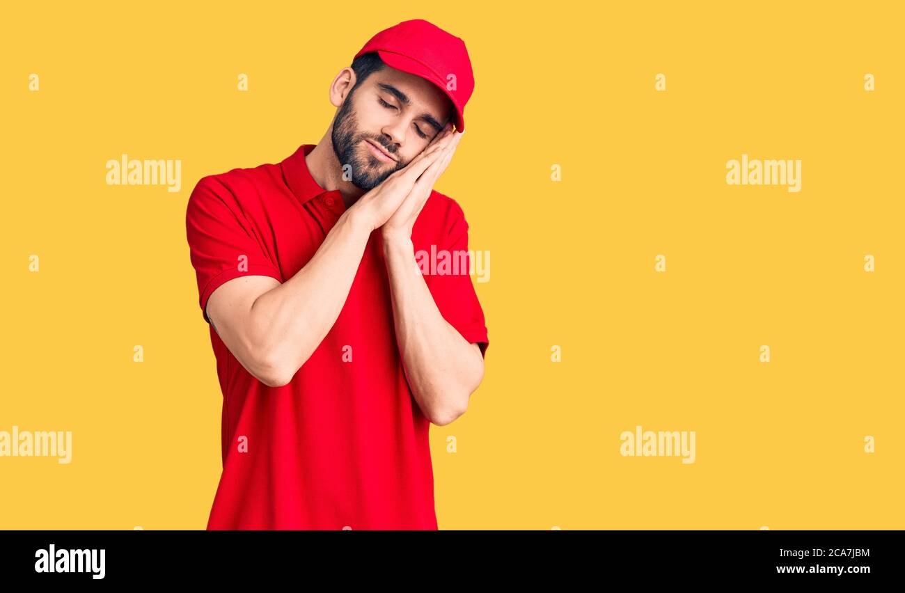 Young Handsome Man With Beard Wearing Delivery Uniform Sleeping Tired