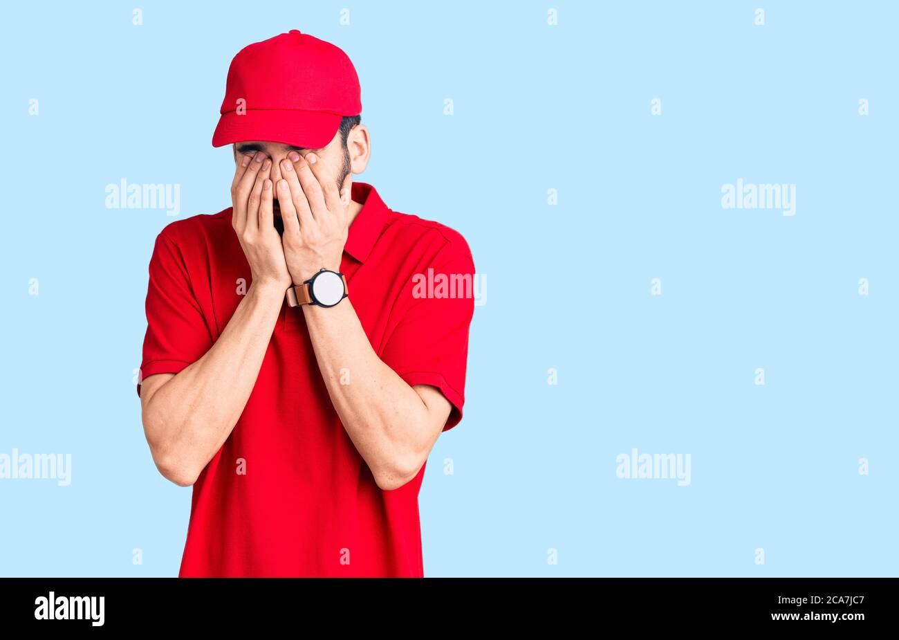 Young Handsome Man With Beard Wearing Delivery Uniform Rubbing Eyes For