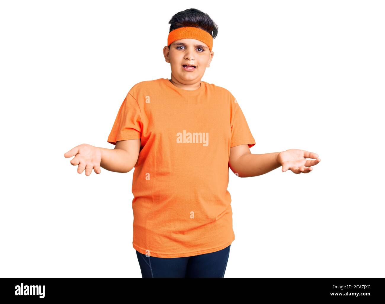 Little boy kid wearing sportswear smiling cheerful offering hands ...