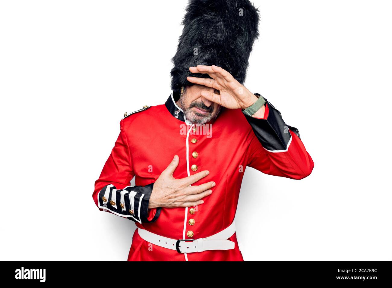 Middle age handsome wales guard man wearing traditional uniform over ...