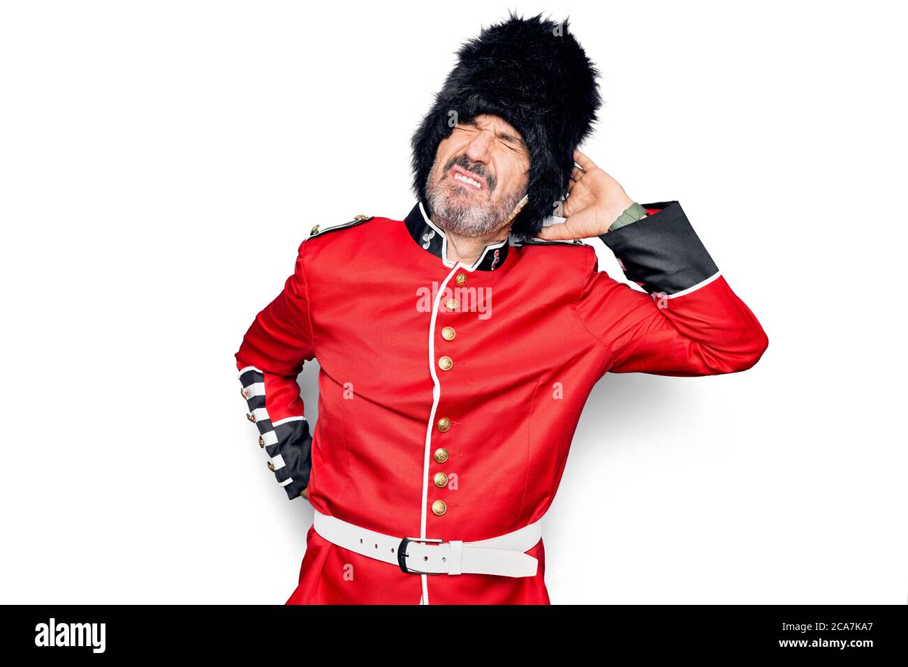 Middle age handsome wales guard man wearing traditional uniform over ...