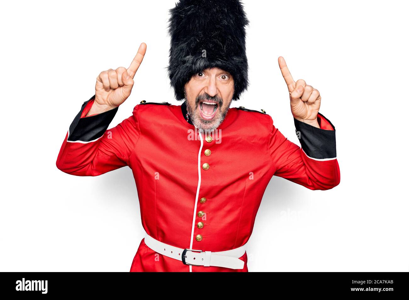 Middle age handsome wales guard man wearing traditional uniform over ...