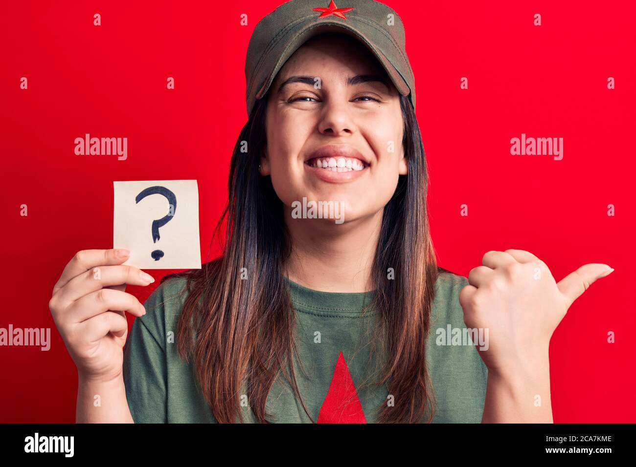 Beautiful woman wearing cap with red star communist symbol holding ...