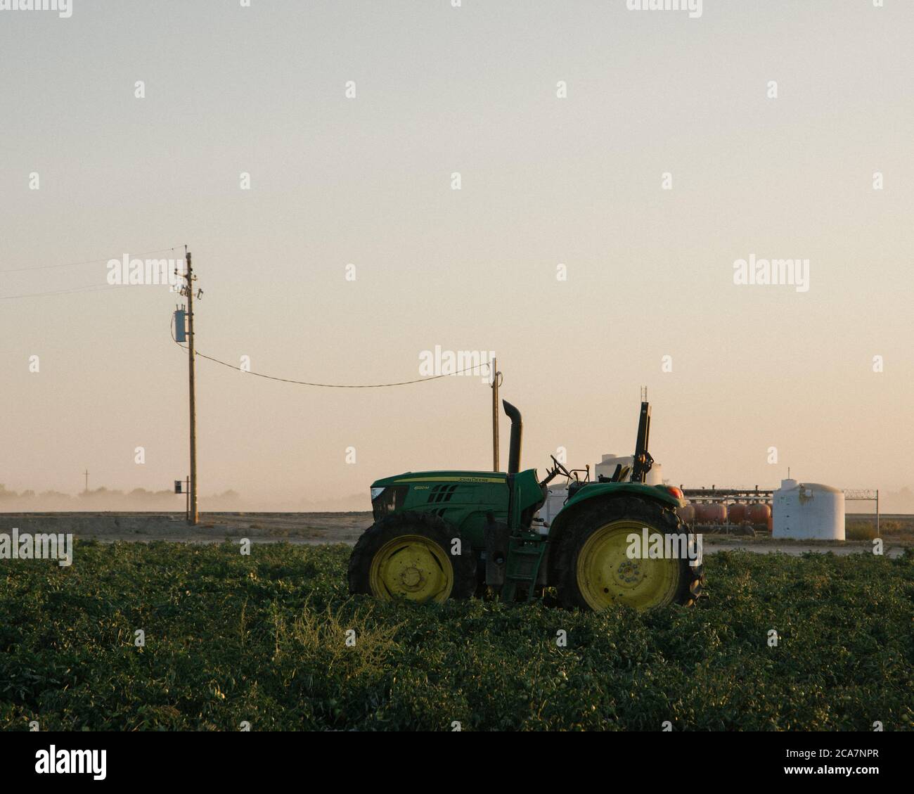 John deere tractor sunset hi-res stock photography and images - Alamy