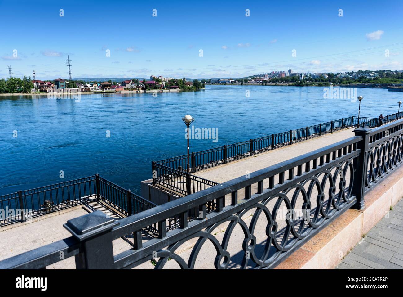 View of the sunny summer embankment of the Angara river in Irkutsk ...
